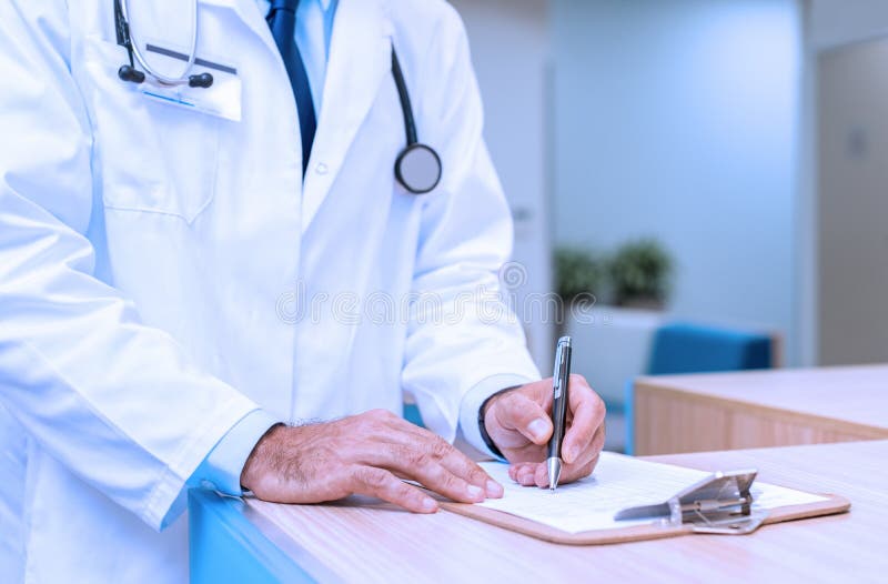 Doctor Making Notes in Medical Card. Stock Image - Image of caucasian ...