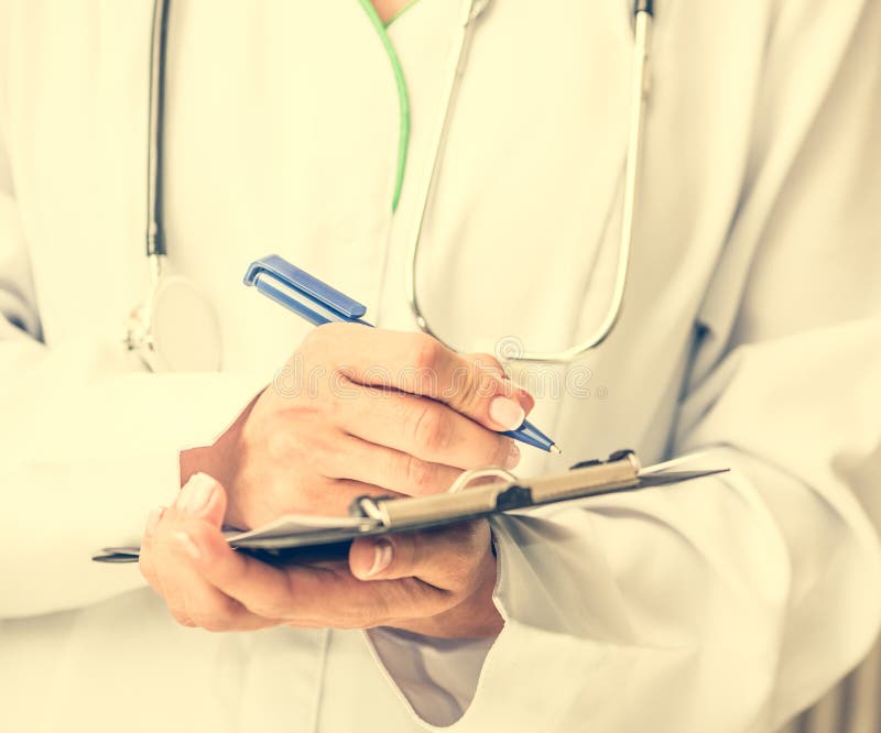 Doctor making notes stock image. Image of professional - 59595589