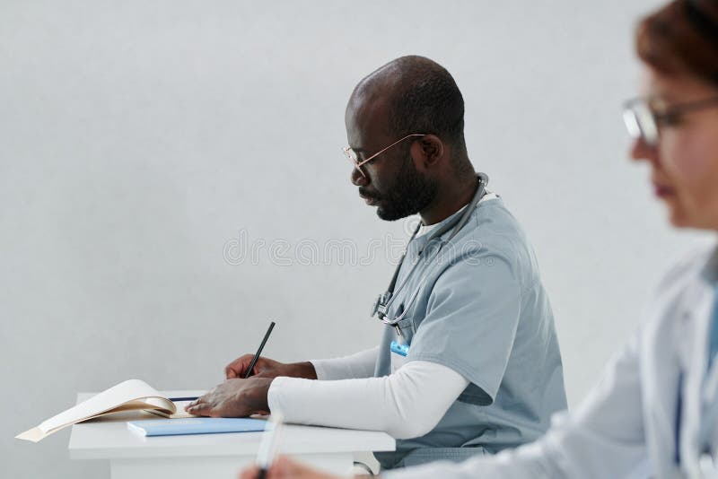 Doctor Making Notes during Training Stock Image - Image of study ...