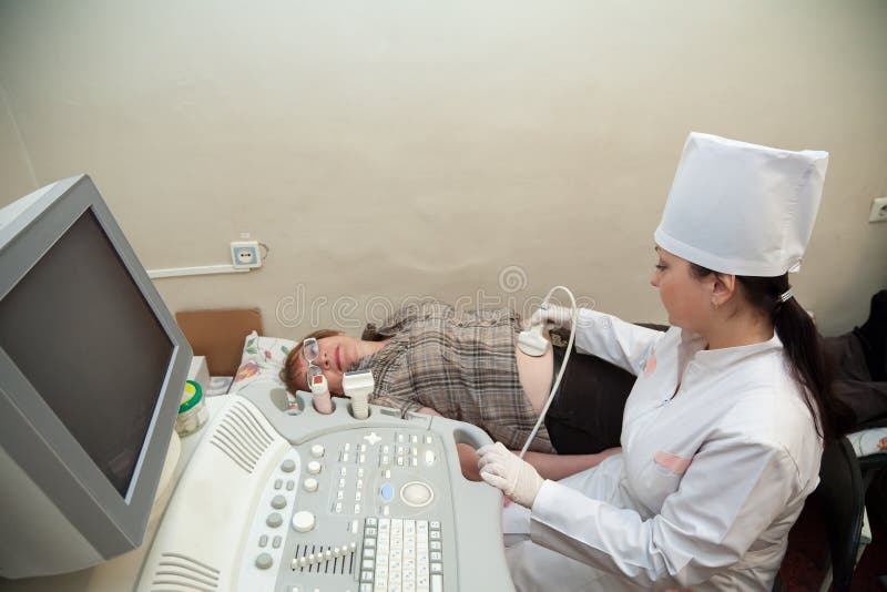 Doctor Making Ultrasound Investigation Stock Photo - Image of ...