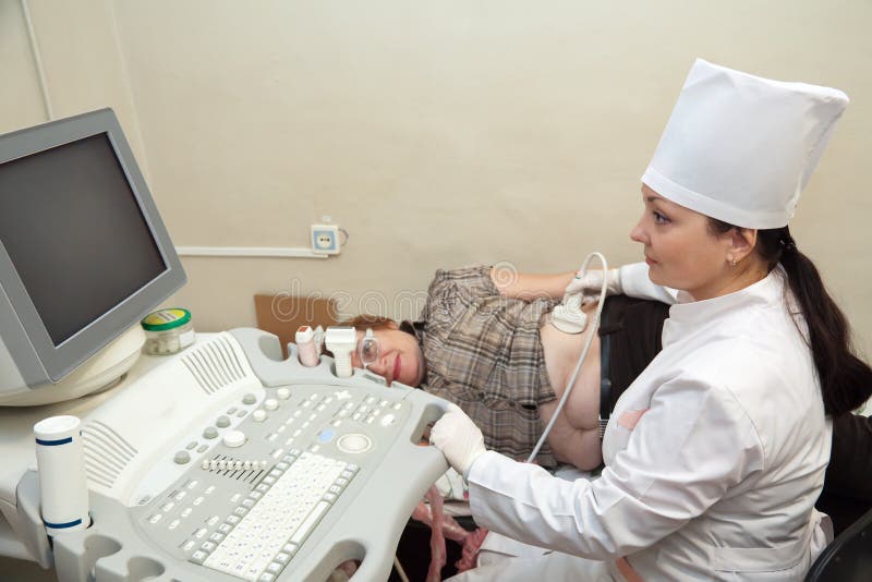 Doctor Making Ultrasound Investigation Stock Photo - Image of ...