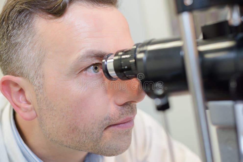 Doctor man with microscope stock photo. Image of professional - 240921568