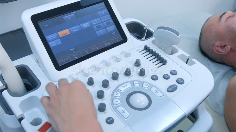 Doctor Working on Computer Making Ultrasound Procedure, Closeup Hands ...