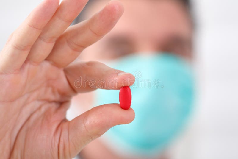 Doctor with Mask Observe Red Pill Stock Image - Image of vitamins ...