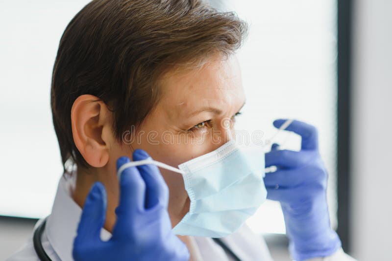 Doctor in Mask with Stethoscope in Hospital. Stock Photo - Image of ...