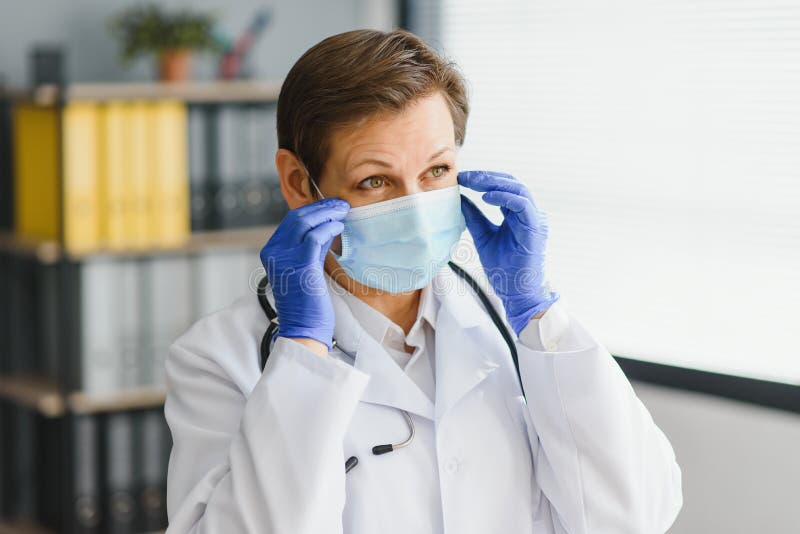 Doctor in Mask with Stethoscope in Hospital. Stock Image - Image of ...