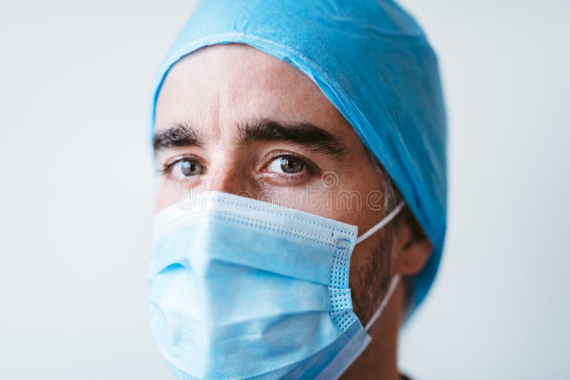 Doctor with Mask and Uniform Facing the Camera Stock Photo - Image of ...