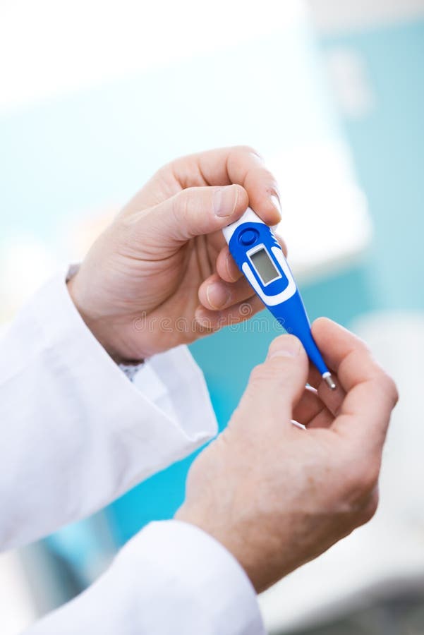 Doctor Measuring Temperature Stock Photo - Image of clinic, coat: 37084122