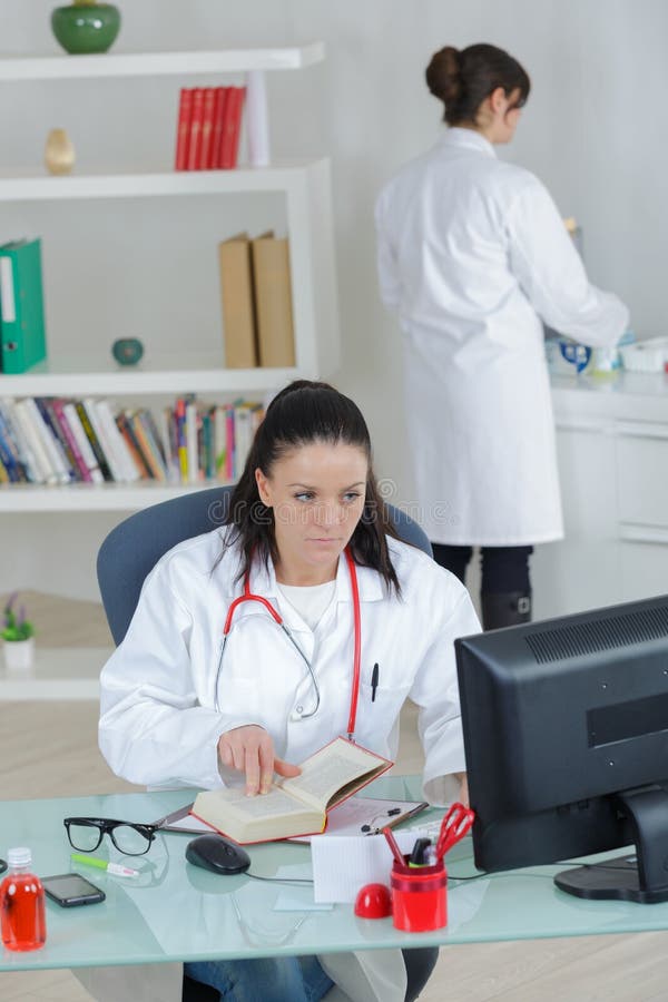 Doctor and Medical Assistant Stock Photo - Image of consultant, office ...