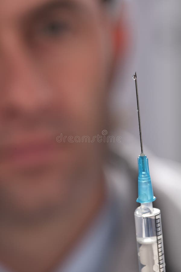 Doctor analyzing a CT scan stock photo. Image of coat - 14211654