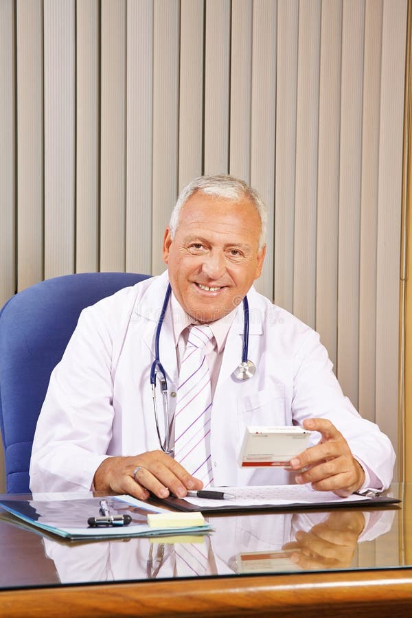 Doctor with Medication in His Office Stock Photo - Image of citizen ...