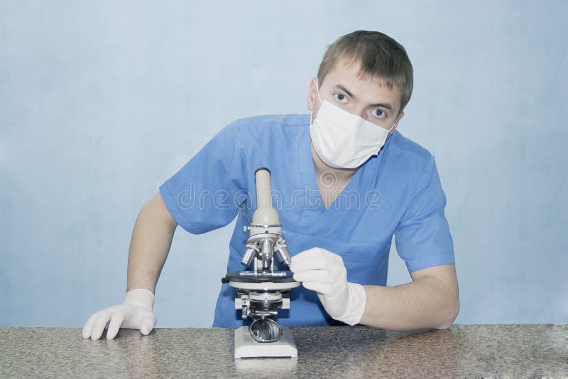 Doctor with Microscope in Lab Stock Photo - Image of adult, people ...