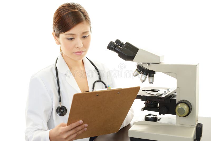 Doctor with a Microscopic Examination Stock Image - Image of friendly ...