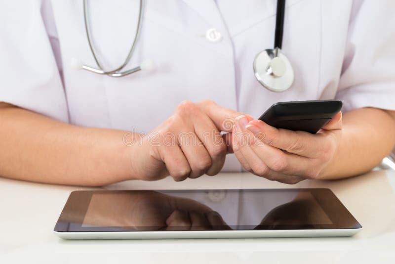 Doctor with Mobile Phone and Digital Tablet Stock Photo - Image of ...