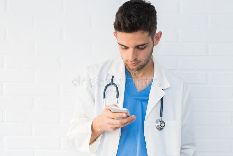 Doctor with mobile phone stock image. Image of licensed - 161748439