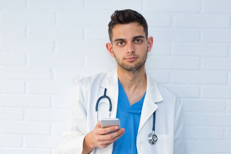 Doctor with mobile phone stock image. Image of device - 161748445