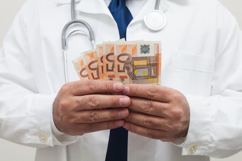 Doctor with money stock photo. Image of coat, healthcare - 30714222
