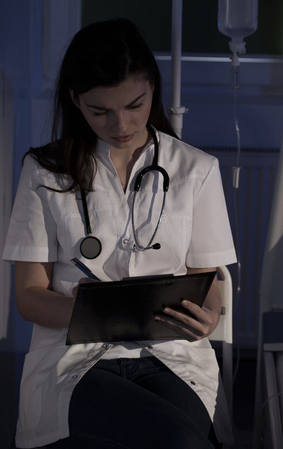 Doctor during night shift stock photo. Image of caucasian - 56806062