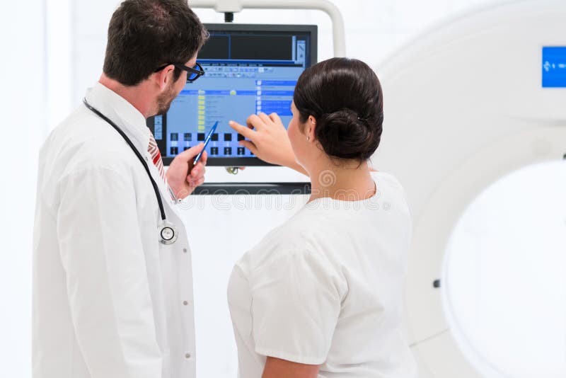 Doctor and Nurse Analyzing Data of CT Scan Stock Image - Image of ...