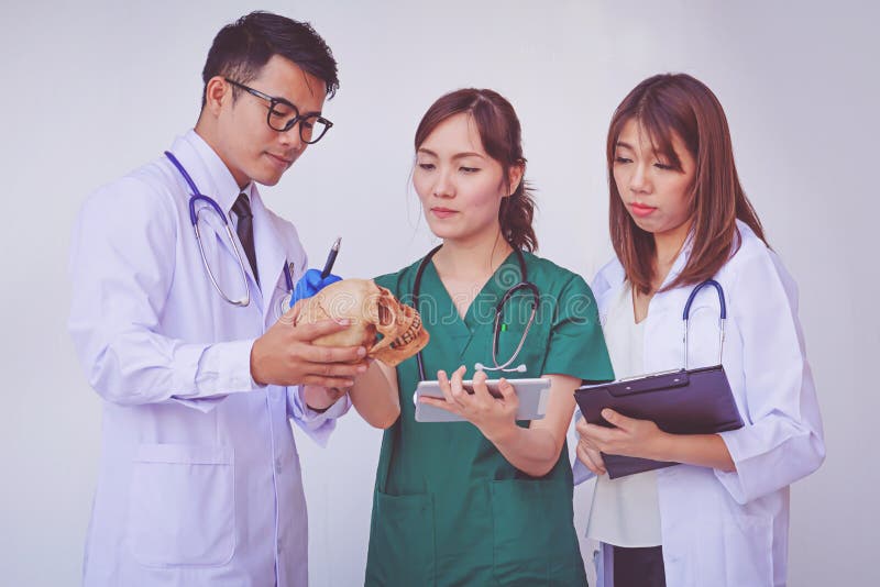 Doctor and Nurse Checking Patient Information on a Tablet Device Stock ...