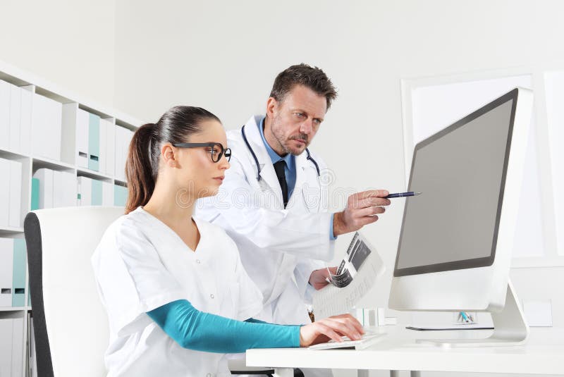 Doctor and Nurse at Computer, Concept of Medical Consulting Stock Image ...
