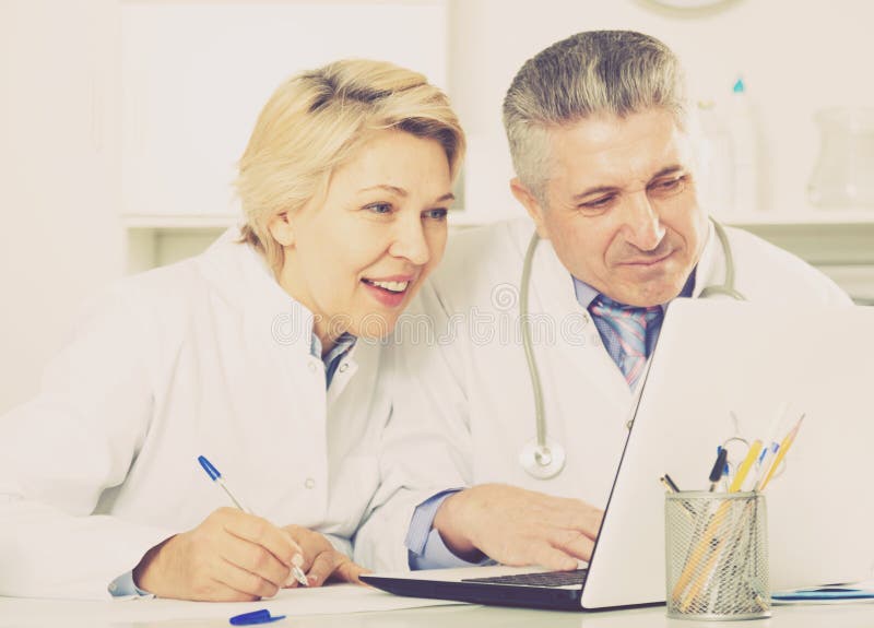 Doctor and Nurse Reading Information Stock Image - Image of information ...