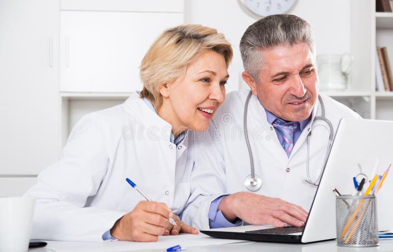 Doctor and Nurse Reading Information Stock Image - Image of medicine ...