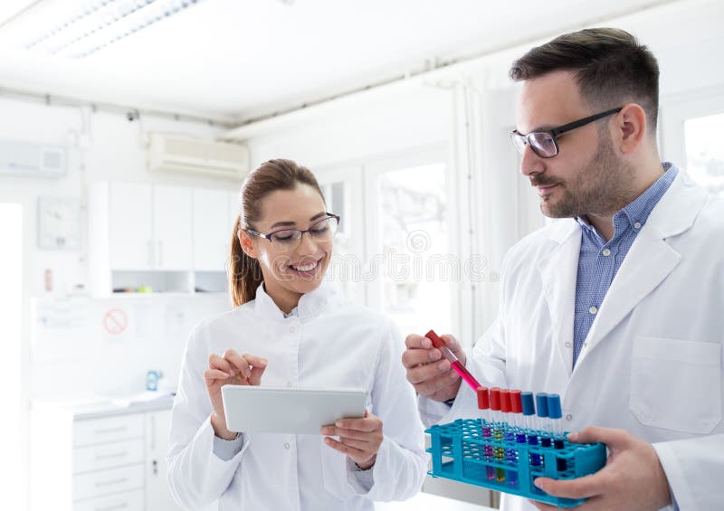 Doctor and Nurse with Test Tubes in Laboratory Stock Photo - Image of ...