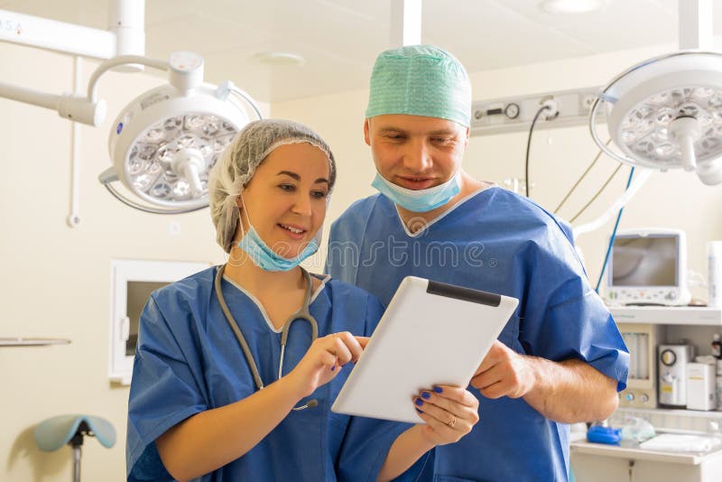 Nurse Using Computer at Nurses Station Stock Photo - Image of american ...