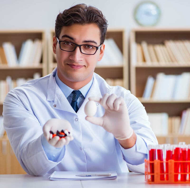 Doctor Offering the Choice between Healthy and Vitamins Stock Photo ...