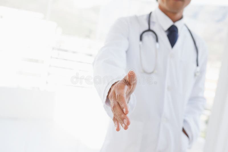 Doctor Reaching Out for a Handshake Stock Photo - Image of profession ...