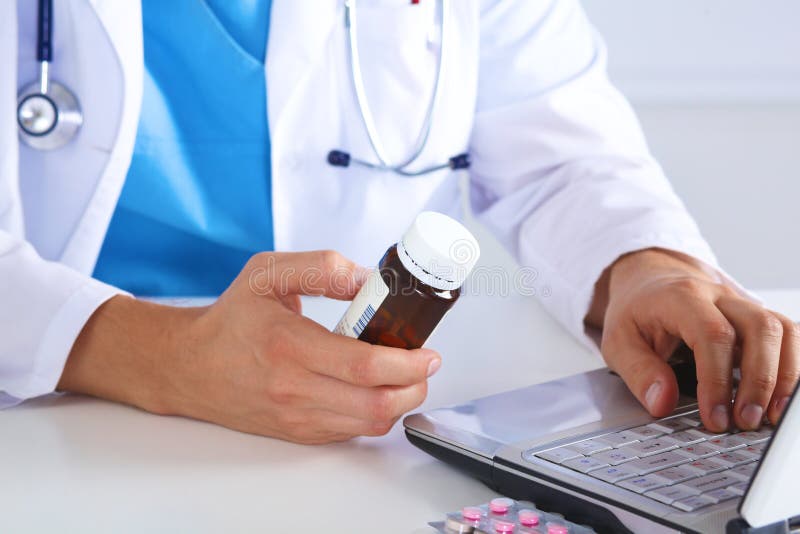 Doctor in the Office Makes an Entry Stock Photo - Image of professional ...