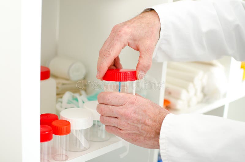 Doctor Opening a Sample Container Stock Image - Image of hospital ...