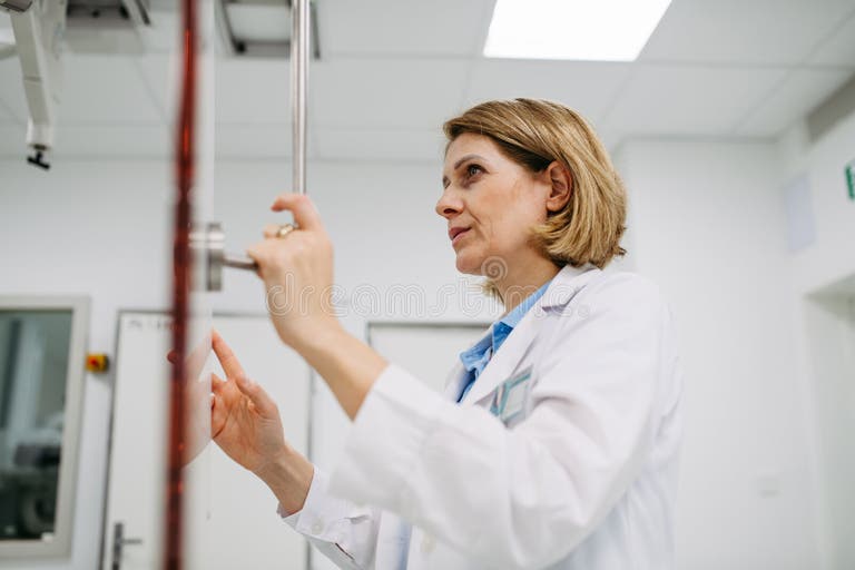 Doctor Operating Dynamic X-ray Scan Using Tilting Fluoroscopy Unit ...