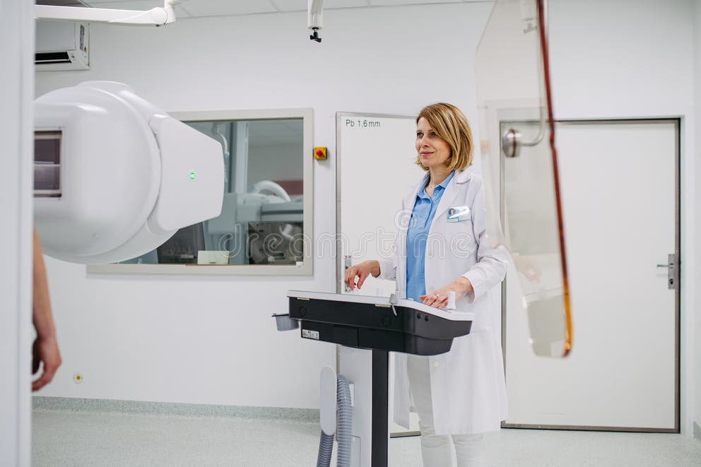 Doctor Operating Dynamic X-ray Scan Using Tilting Fluoroscopy Unit ...