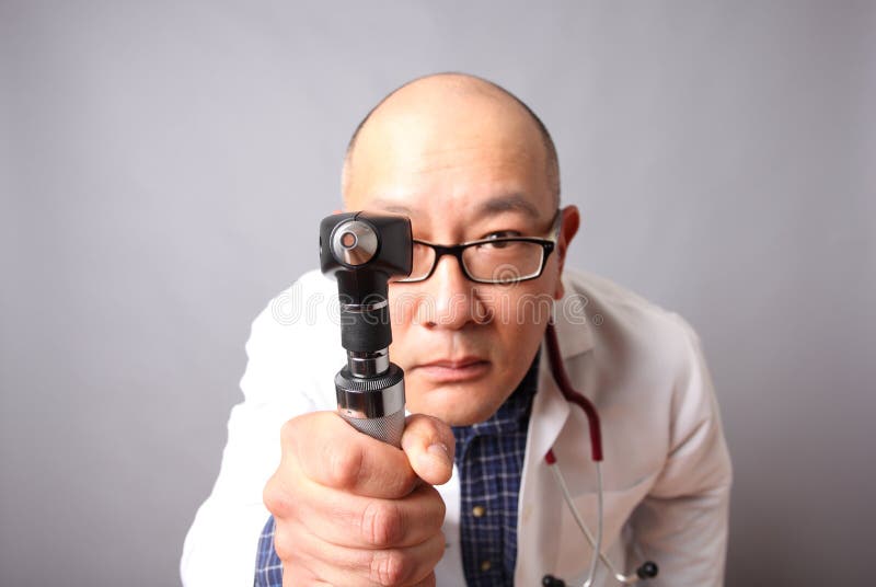Doctor with otoscope stock image. Image of otoscope, stethoscope - 21227087