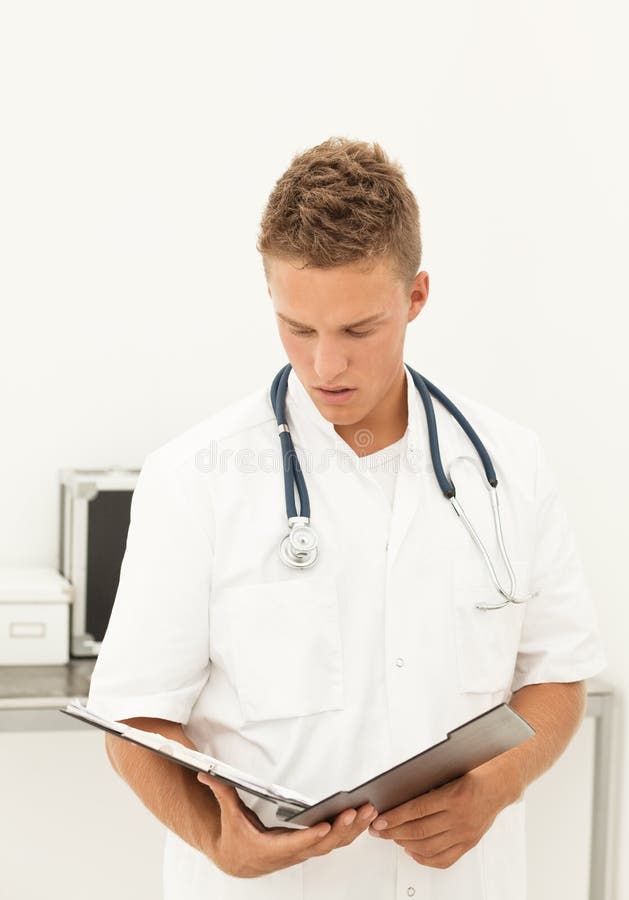 Doctor with papers stock image. Image of handsome, young - 11134373