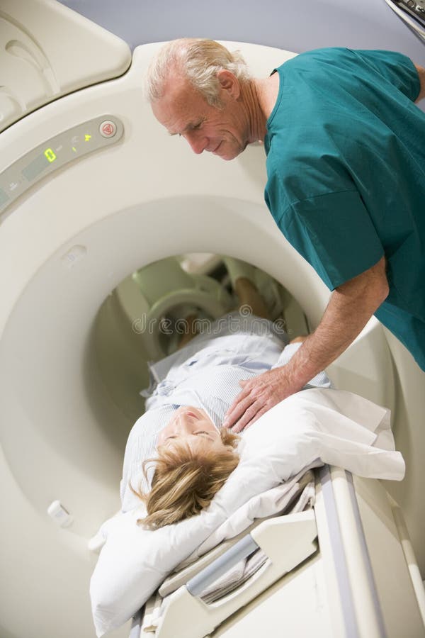 Doctor with Patient As they Have CAT Scan Stock Image - Image of ...