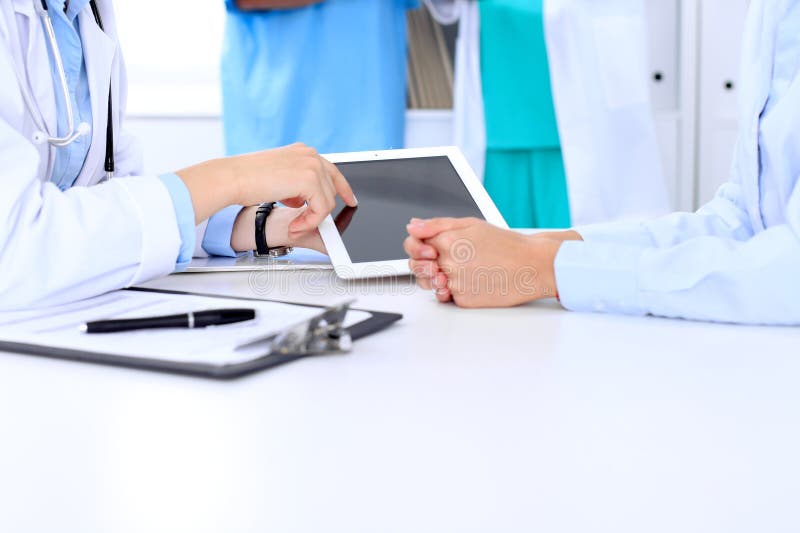 Doctor and Patient are Discussing Something. Physician Pointing into ...