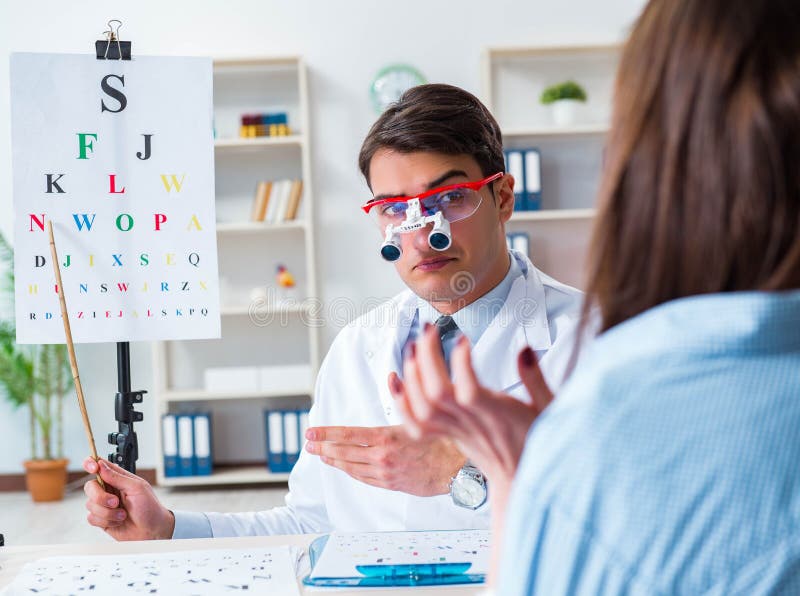 Doctor with Patient at Eye Exam Stock Image - Image of oculist, doctor ...