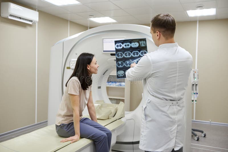 The Doctor and the Patient Look at the Results of the MRI Image Stock ...