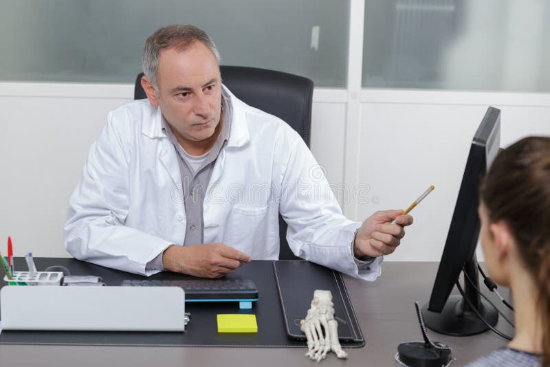 Doctor and Patient with Pc in Clinic Stock Photo - Image of device ...