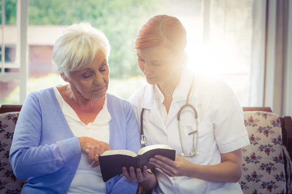 Doctor and Patient Reading a Book Stock Image - Image of home ...