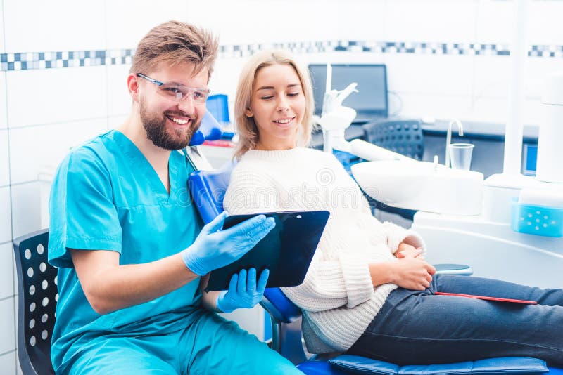 Doctor with Patient Reading Notes Stock Photo - Image of notes ...