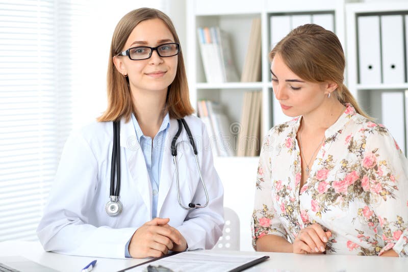 Doctor and Patient Sitting at the Desk Stock Image - Image of medic ...