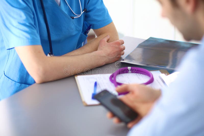 Doctor and Patient at the Table. Solution Stock Photo - Image of ...