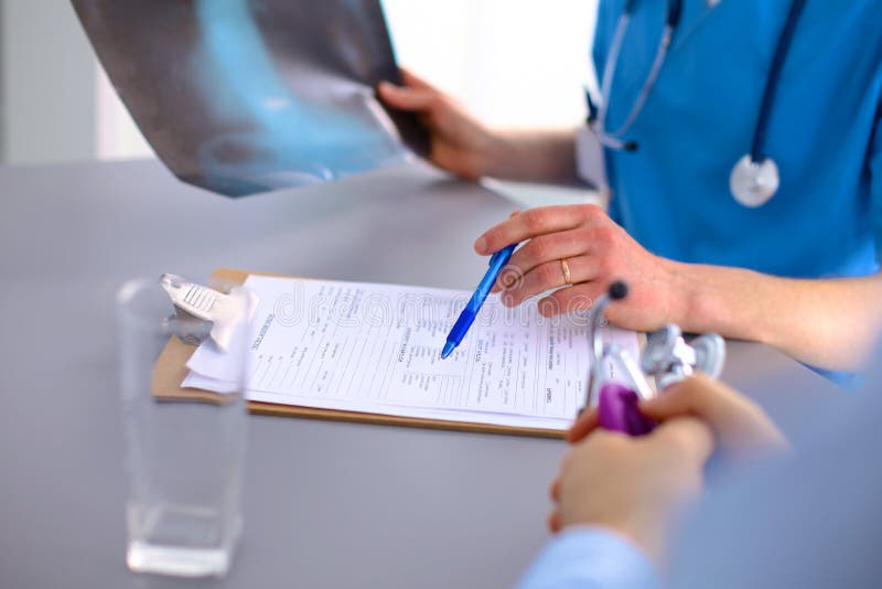 Doctor and Patient at the Table. Solution Stock Image - Image of ...