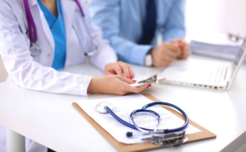 Doctor and Patient at the Table. Solution Stock Photo - Image of clinic ...