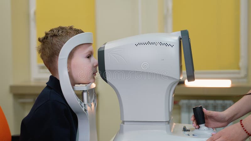 Child Patient Undergoing Autorefractor Eye Exam Stock Footage - Video ...