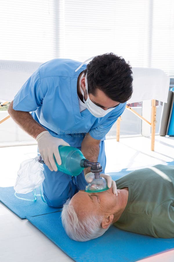 Doctor Performing Resuscitation on Patient Stock Image - Image of mask ...